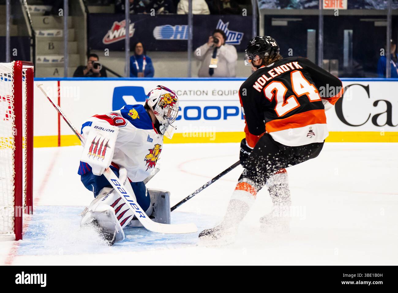 Moncton Wildcats goaltender Mathis Rousseau (60) makes a save on ...