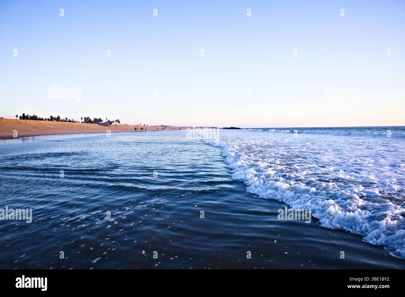 Waves washing ashore Stock Photo - Alamy