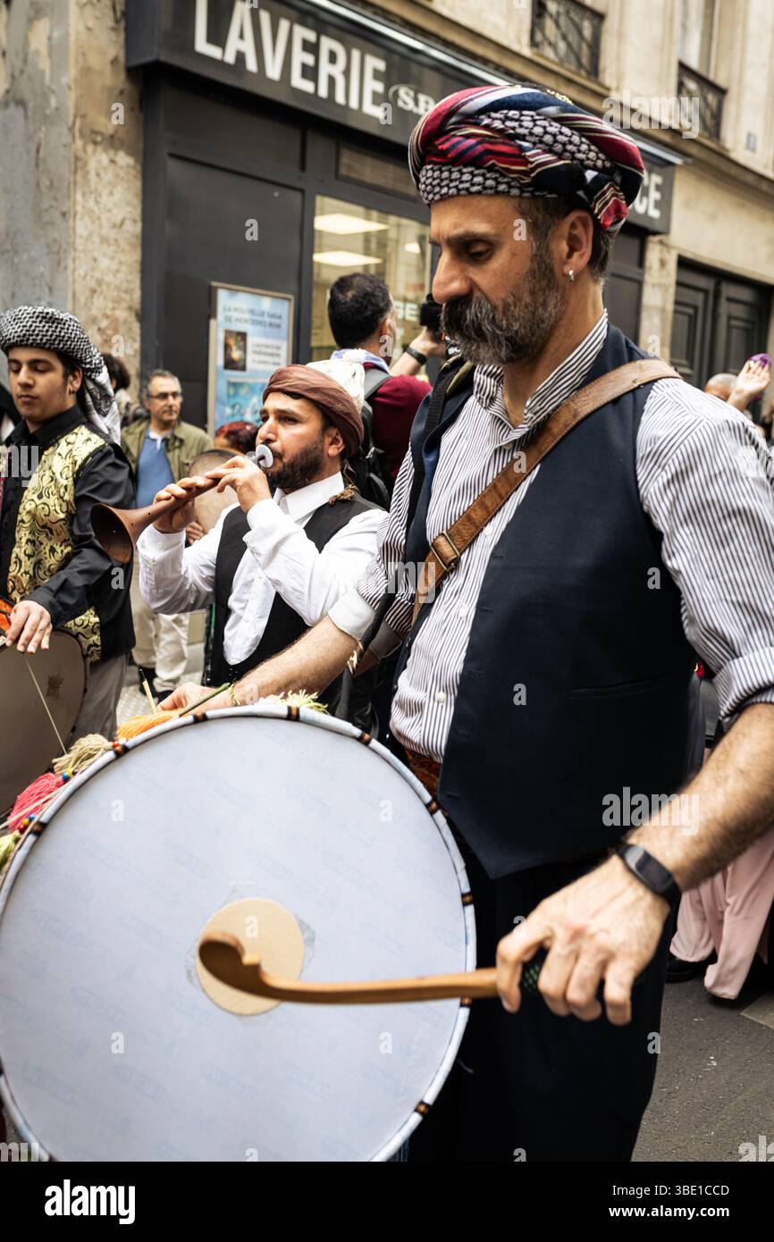 Paris, France. 17th May, 2025. A kurdish musician is seen playing a ...