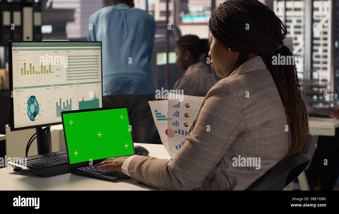 Corporate employee focused on strategic planning next to green screen ...