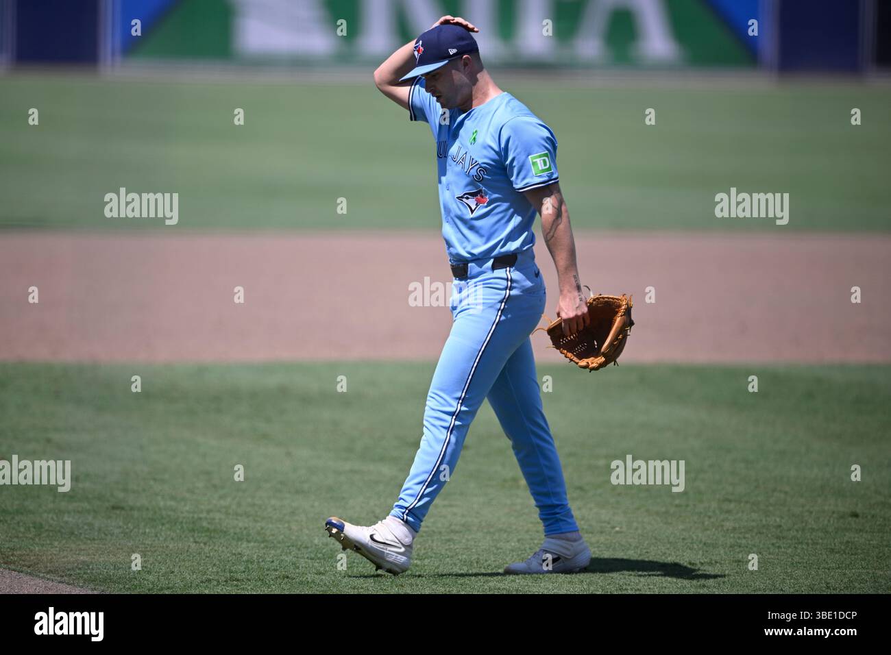 Toronto Blue Jays pitcher Mason Fluharty walks to the dugout after ...