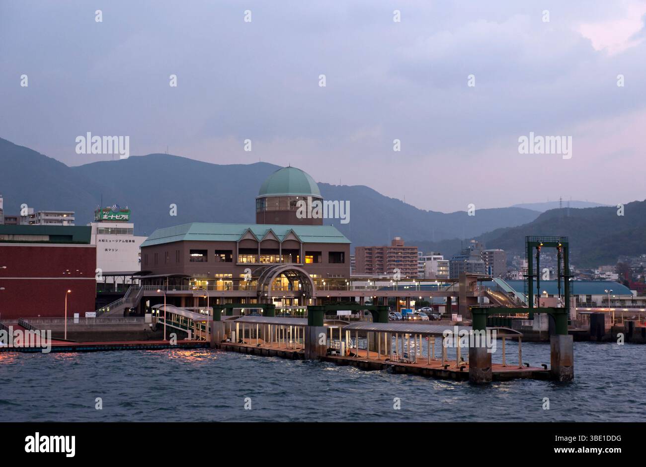 Ferry dock at Kure Port in Hiroshima Prefecture is a busy industrial ...
