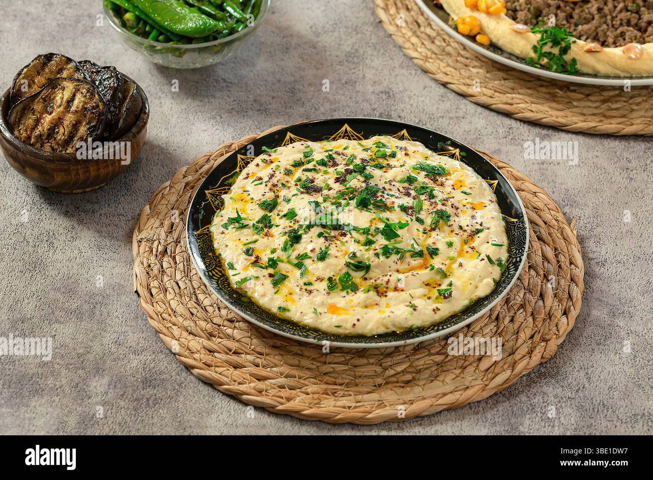 Smoky grilled eggplant dip with tahini and lemon – a traditional Middle ...