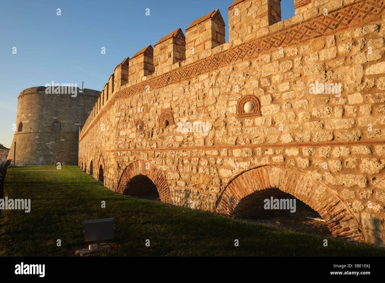A look at one of the long, stone walls of the fort. Exterior view at ...