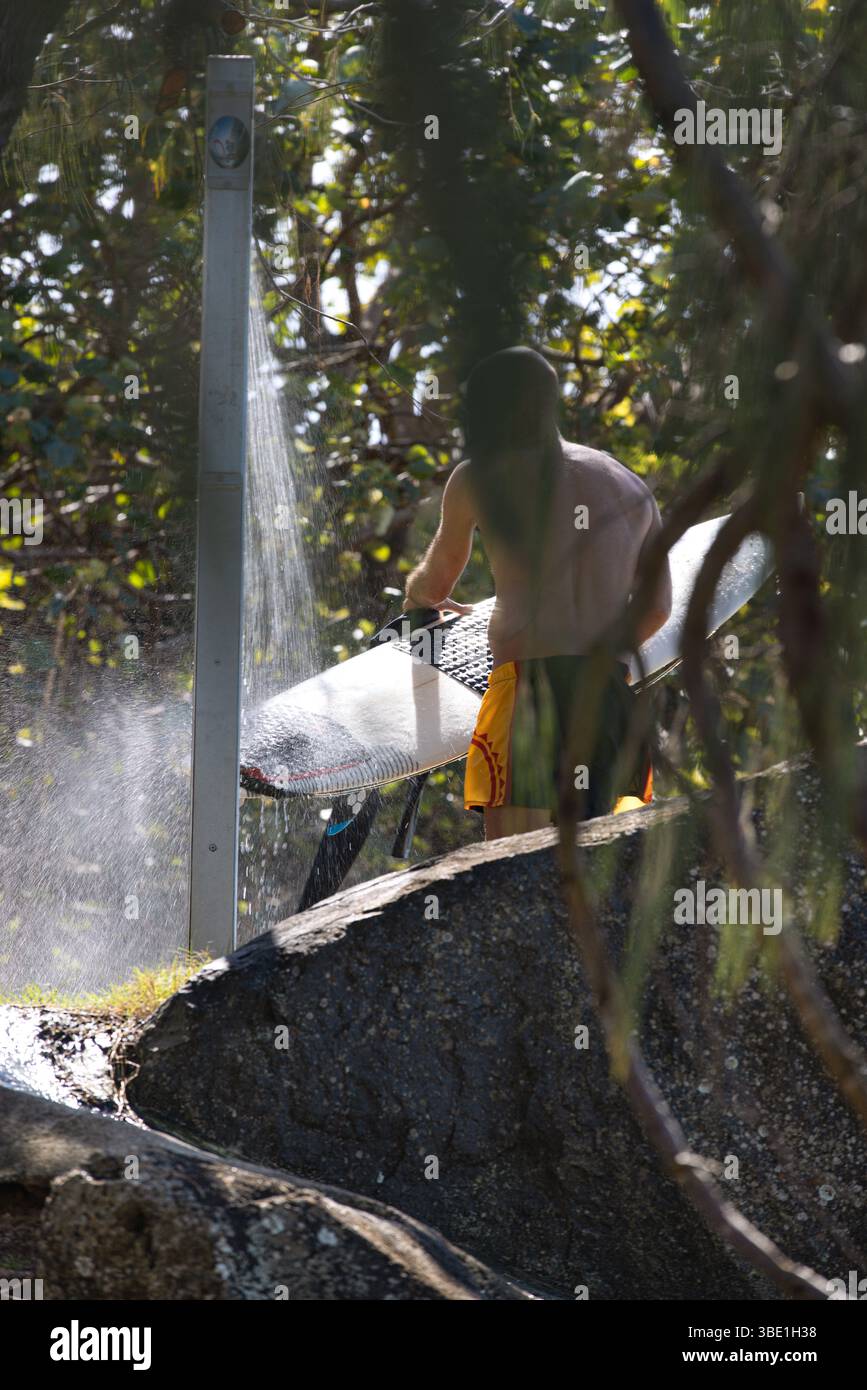 Surfer washing surfboard hi-res stock photography and images - Alamy