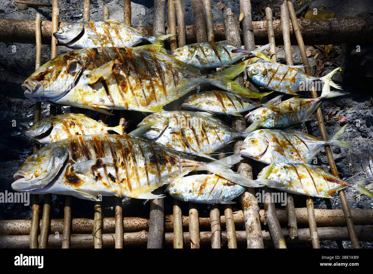 grilled fish coking on a beach at The Seventeen island Sea Garden in ...