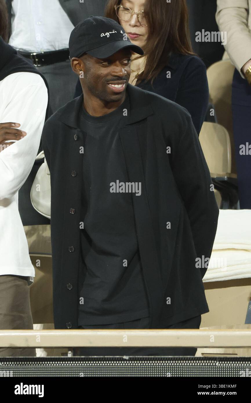Ousmane Dembele of PSG watching the victory of Jannik Sinner of Italy ...
