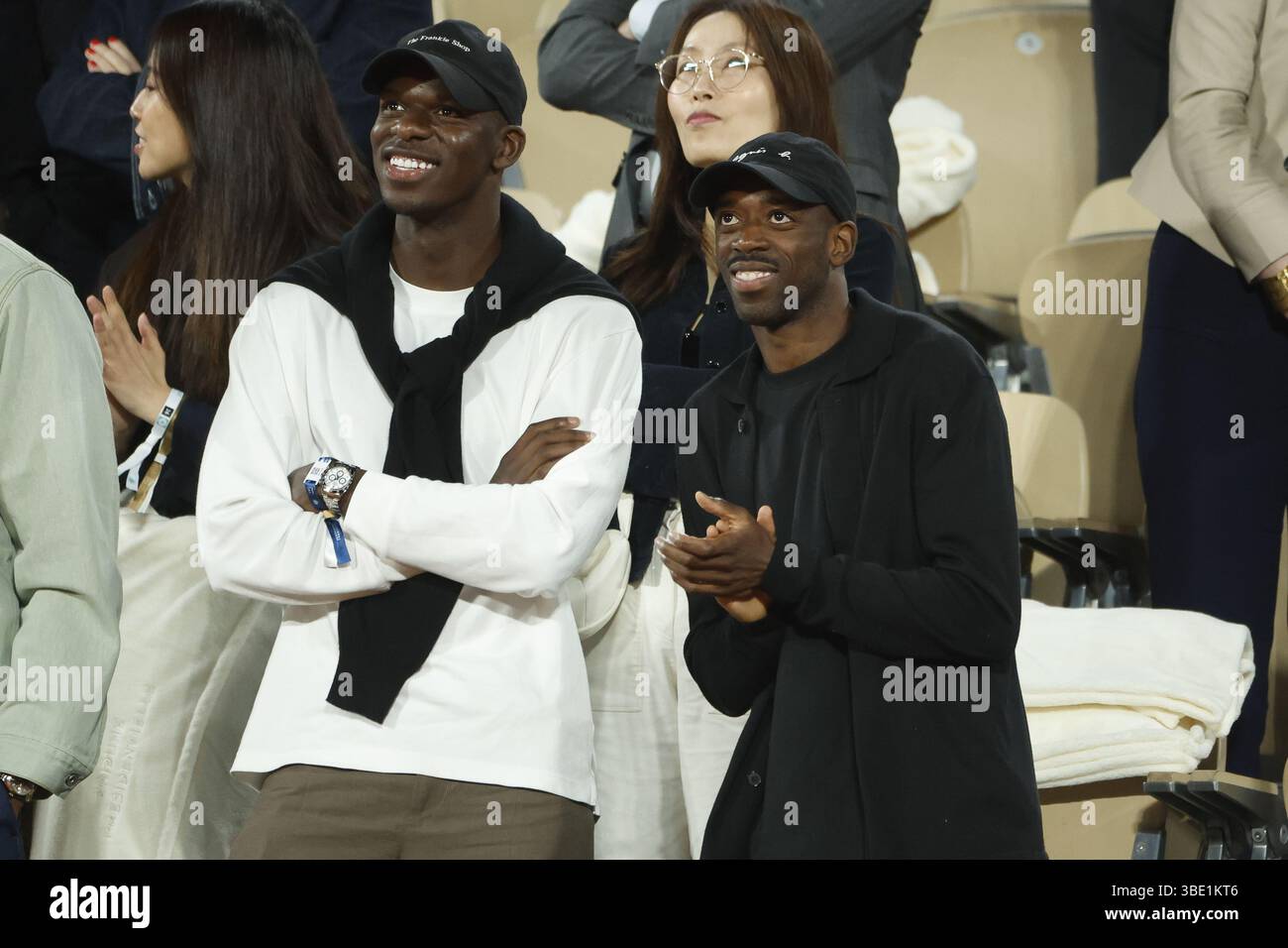 Ousmane Dembele of PSG (R) watching the victory of Jannik Sinner of ...