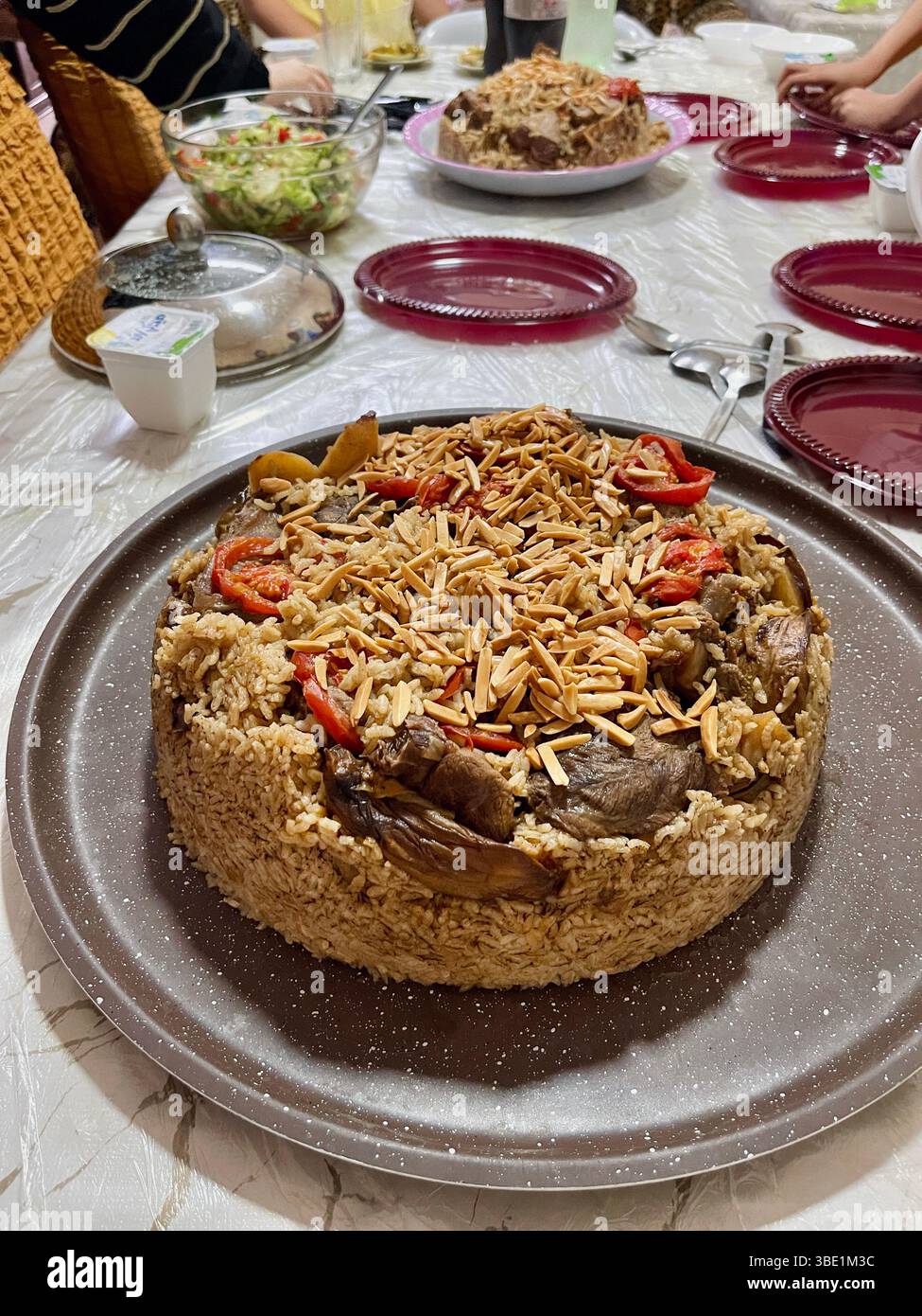 Traditional Palestinian maqluba with layers of rice, vegetables, beef ...