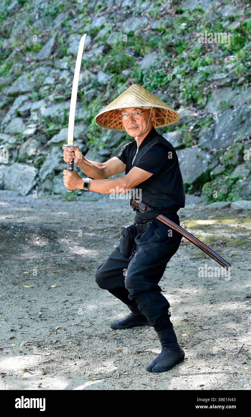 Samurai posing with katana sward in front of Wakayama castle,Japan,Asia ...