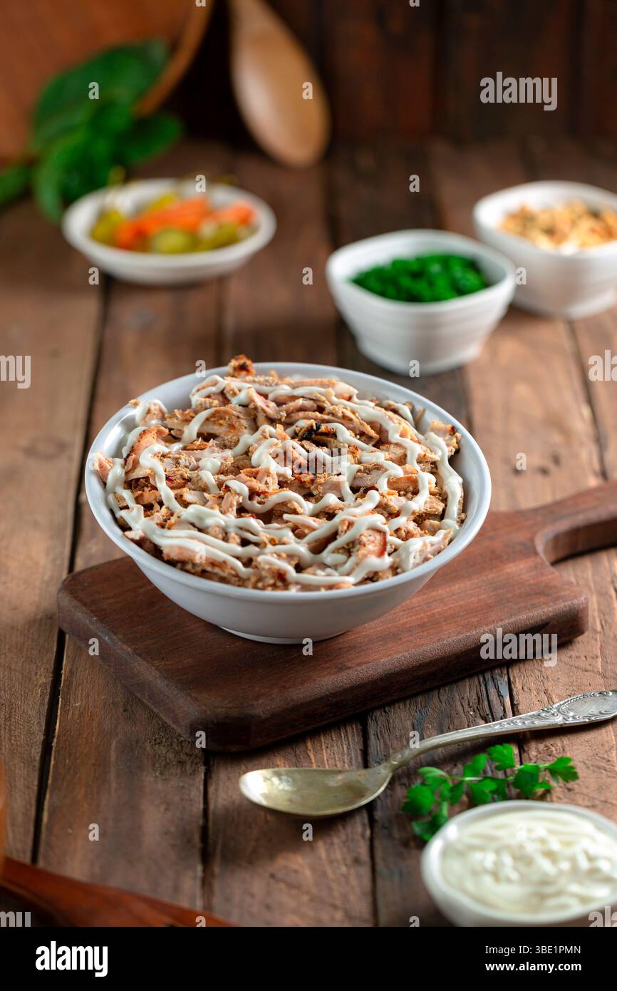 Shawarma fatteh with garlic cream sauce, Syrian Arabic food Stock Photo ...