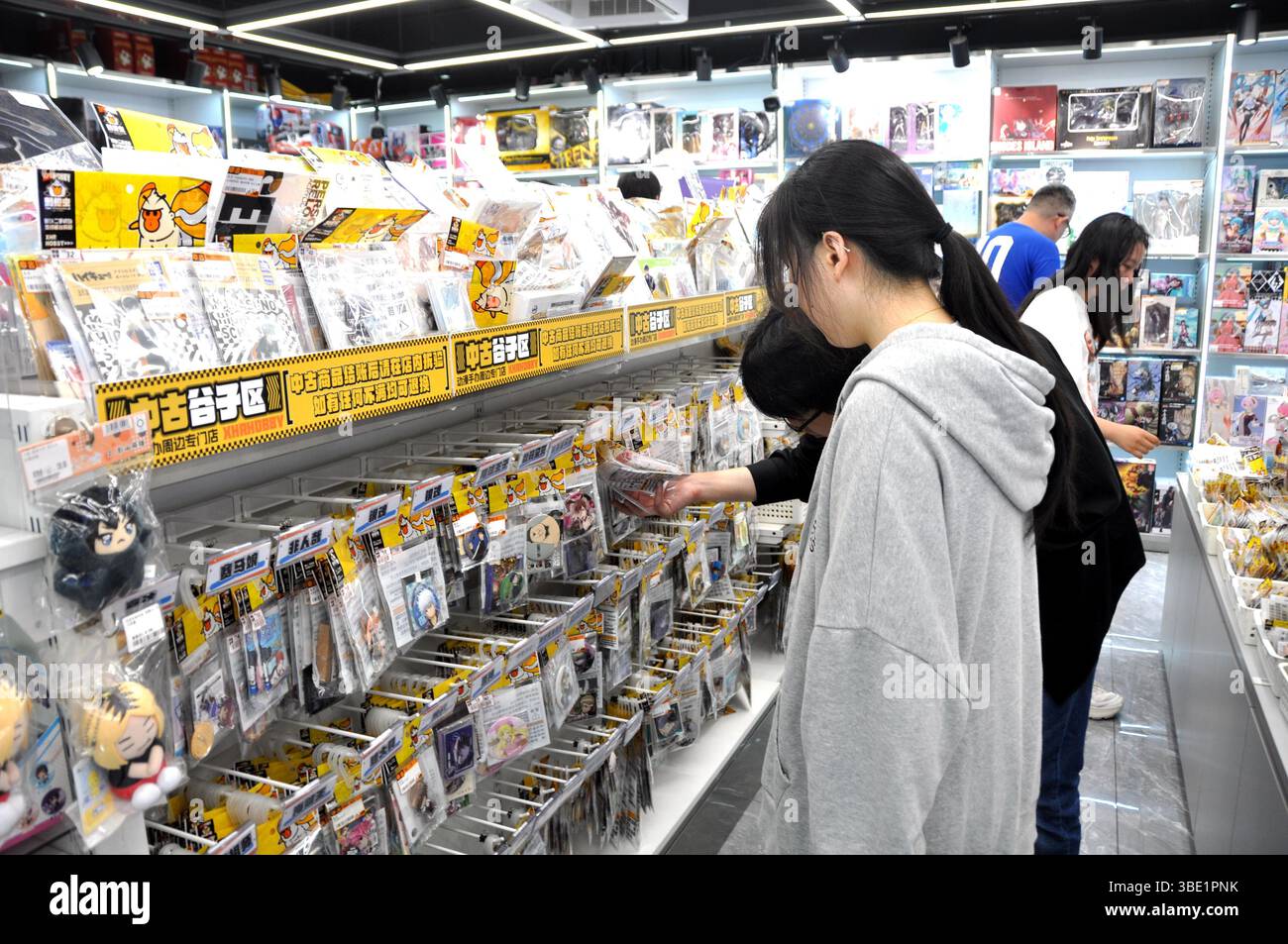 Consumers shop at a guzi store in Shanghai, China, 24 May, 2025 Stock ...