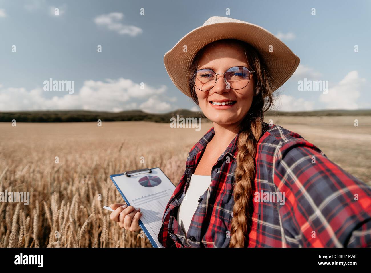Smiling Female Farmer Taking a Selfie in a Wheat Field Stock Photo - Alamy