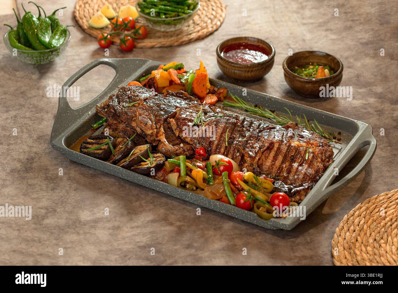 Roasted meat tray with vegetables, Arabic Eastern food Stock Photo - Alamy