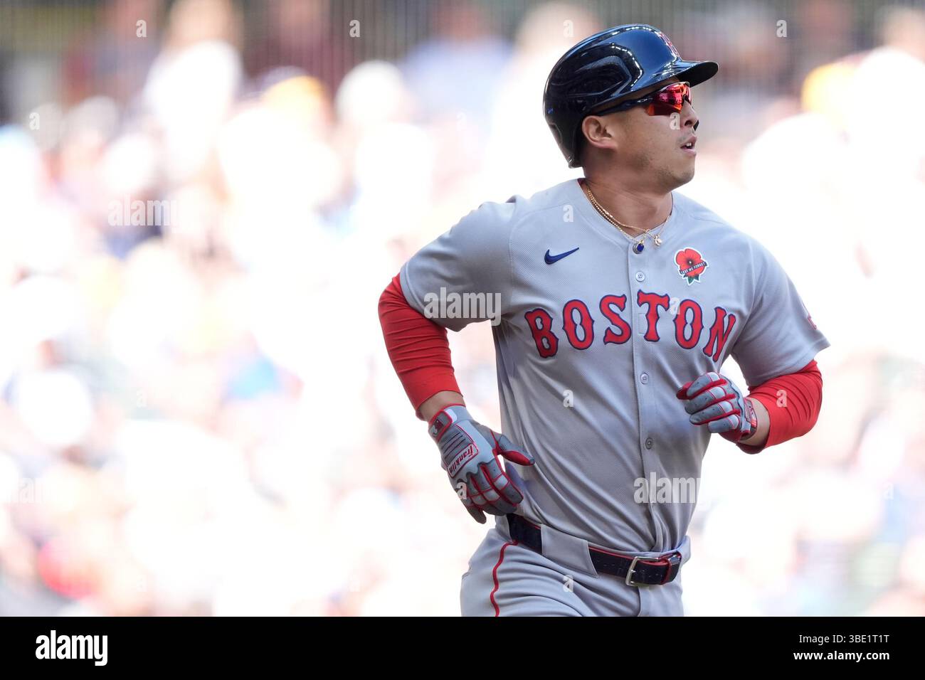 Boston Red Sox's Rob Refsnyder jogs to first base after drawing a walk ...
