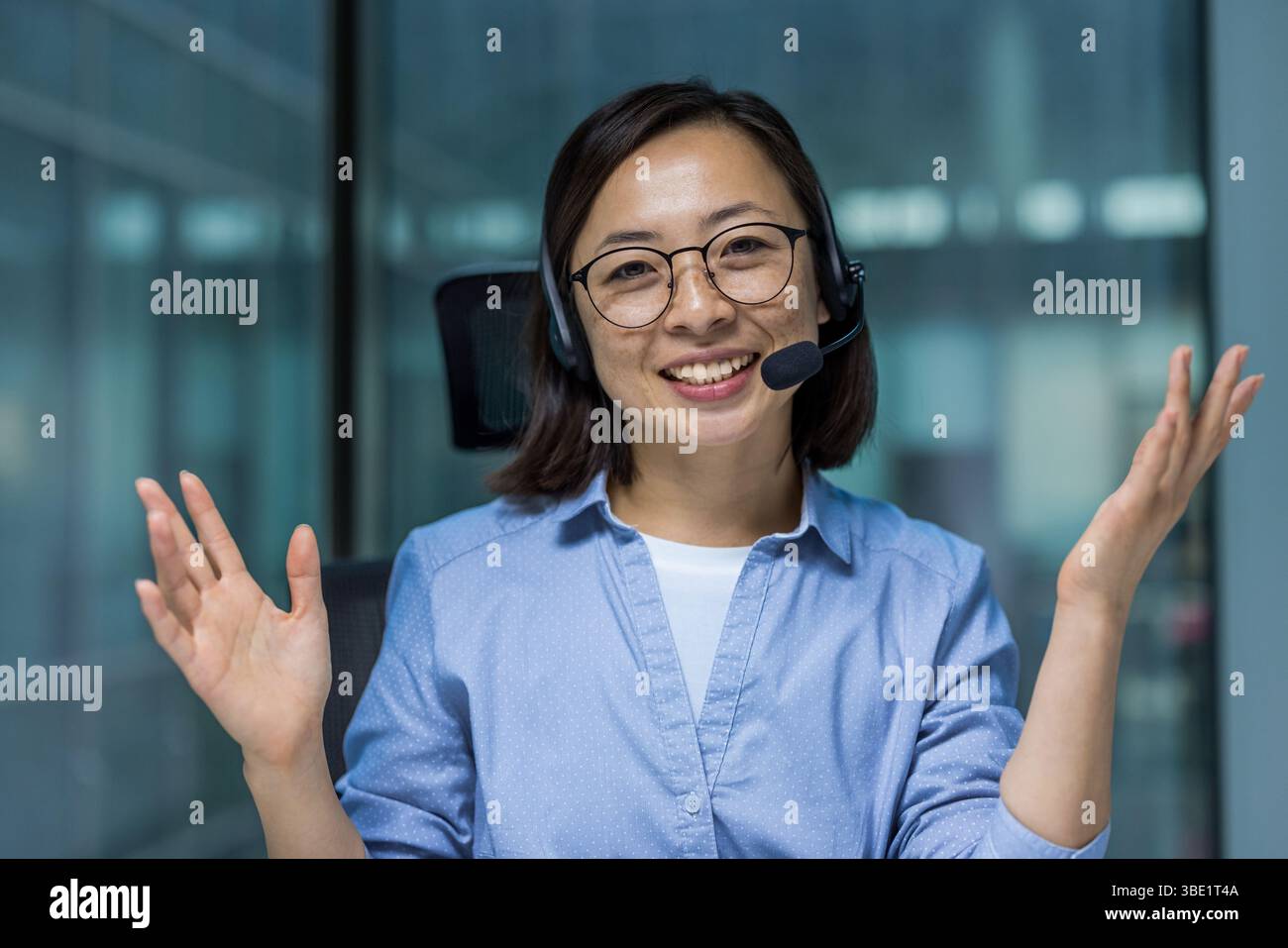 A friendly customer service representative wearing a headset smiles ...
