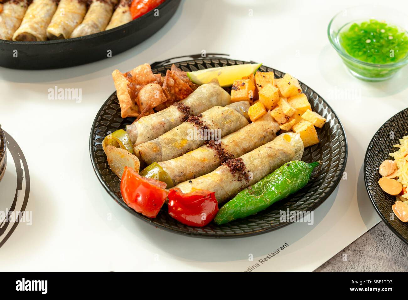 Musakhan rolls plate, traditional Arabic food Stock Photo - Alamy