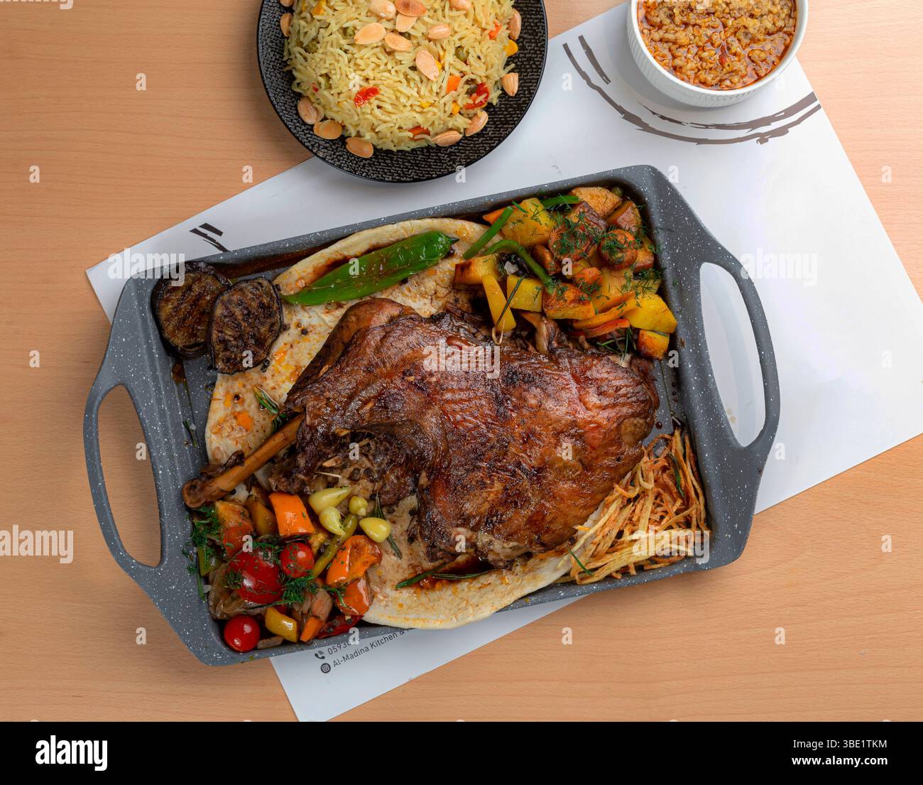 Oven-roasted turkey thigh with vegetables and appetizers, Middle ...