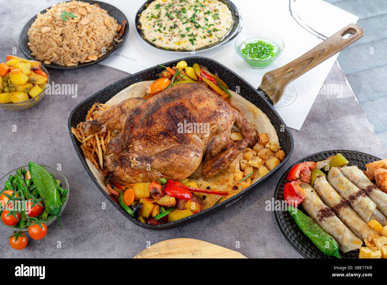 Grilled stuffed chicken with vegetables and full appetizers, Arabic ...