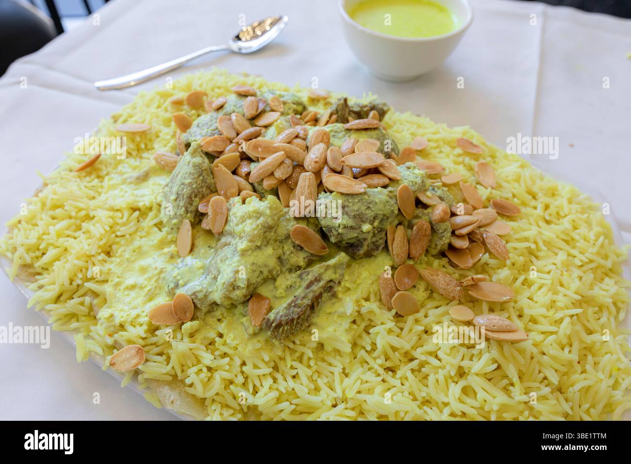 Yellow rice with lamb, original Jordanian Mansaf Stock Photo - Alamy
