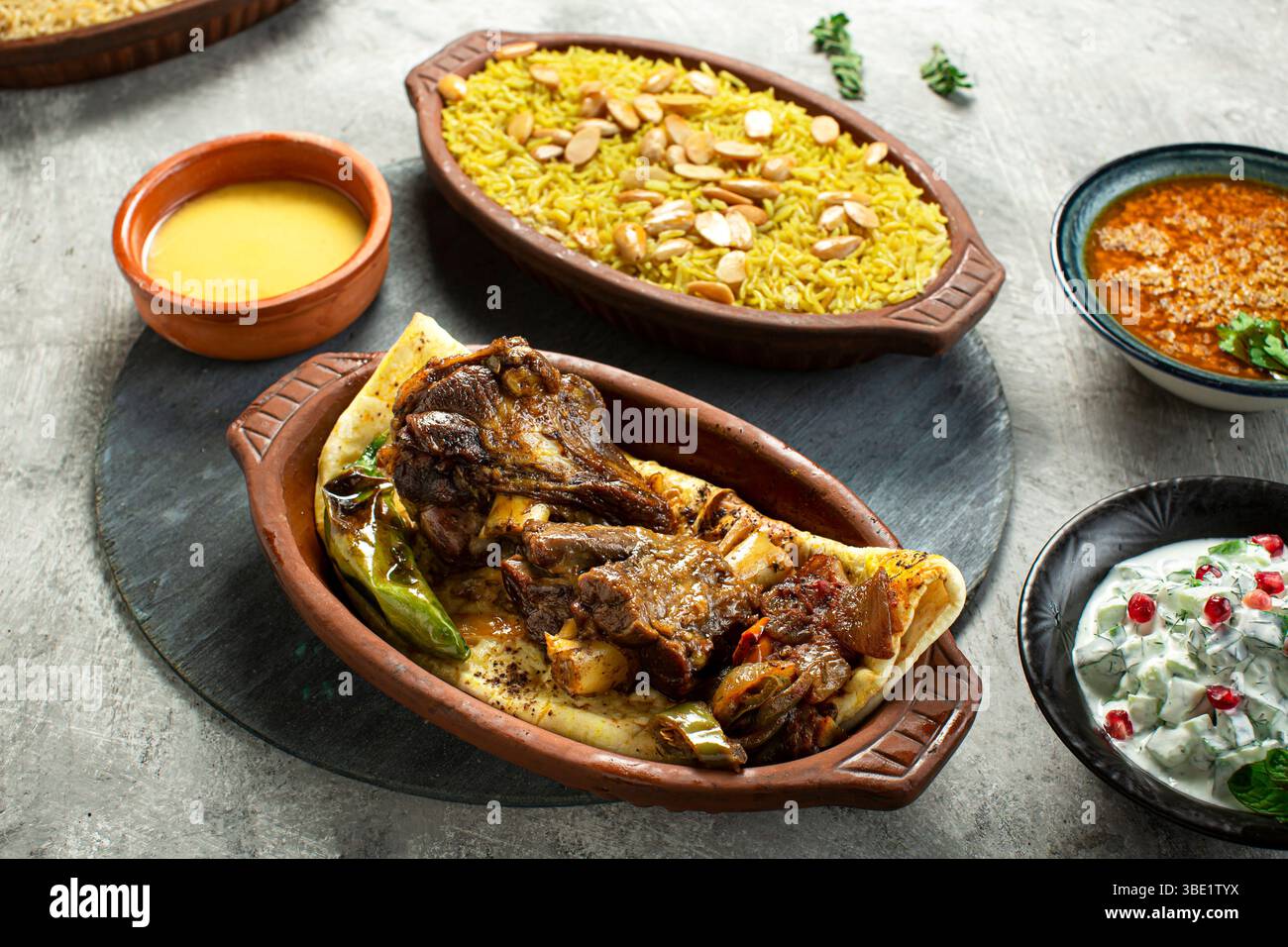 Oven-roasted lamb with yellow rice, traditional Arabic Eastern food ...