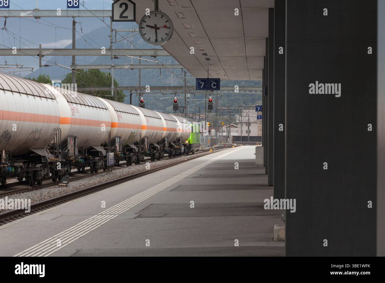 A rail freight train of pressure tanks waiting to head east at Visp ...