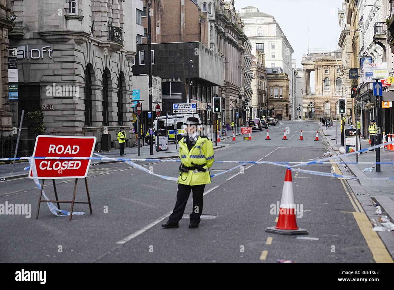 A police officer at the scene in Water Street near the Liver Building ...