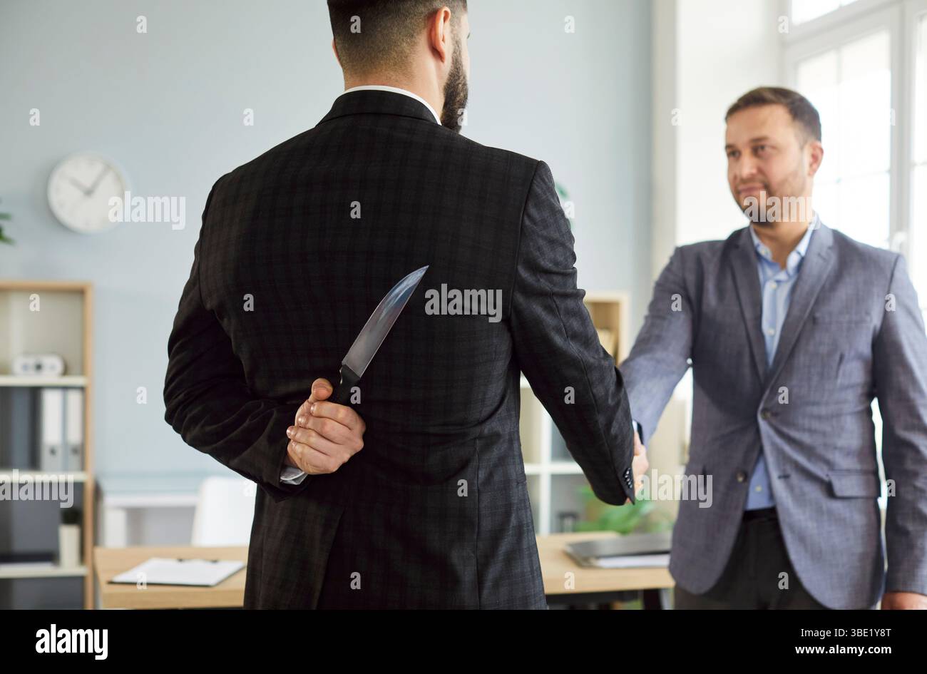 Backstabbing criminal hi-res stock photography and images - Alamy