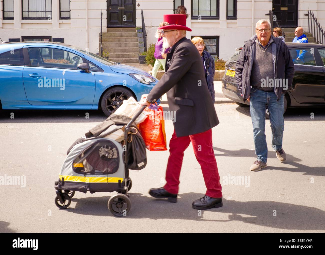 Steampunk weekend at Filey in North Yorkshire with man pushing a dog ...