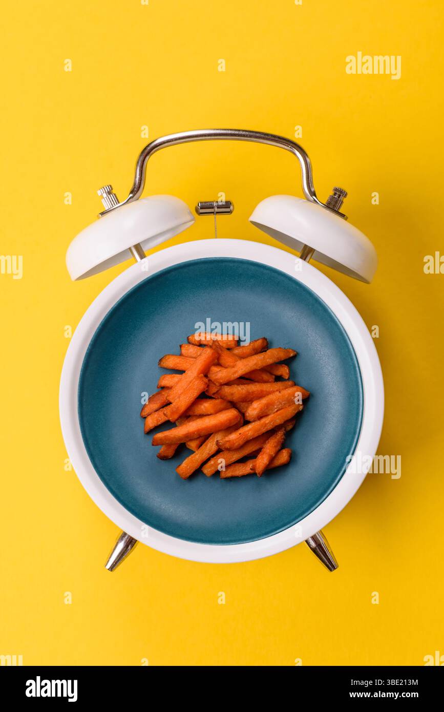 Sweet potato fries fried in oil, junkfood, food to go . Concept time to ...