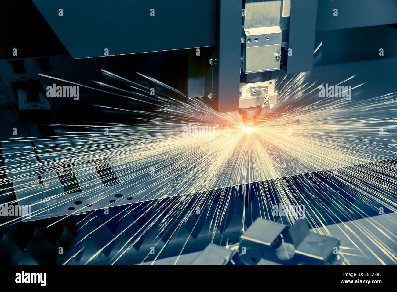 CNC laser cutting metal sheet with bright sparkle in factory Stock ...