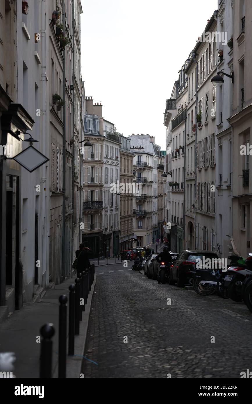 Narrow Parisian Cobblestone Street Uphill with Parked Motorcycles and ...