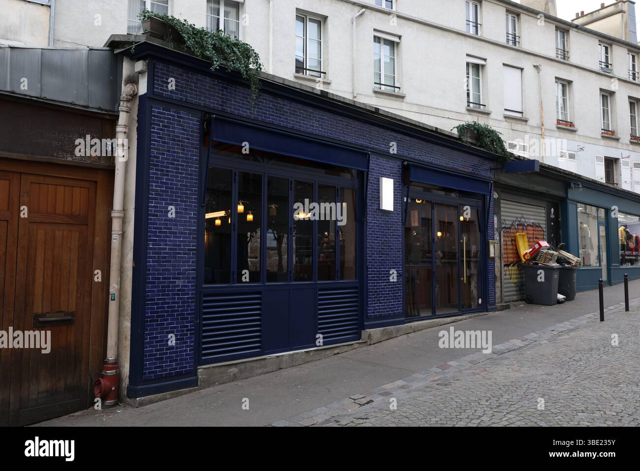 Modern Blue Brick Restaurant on Sloping Parisian Cobblestone Street ...