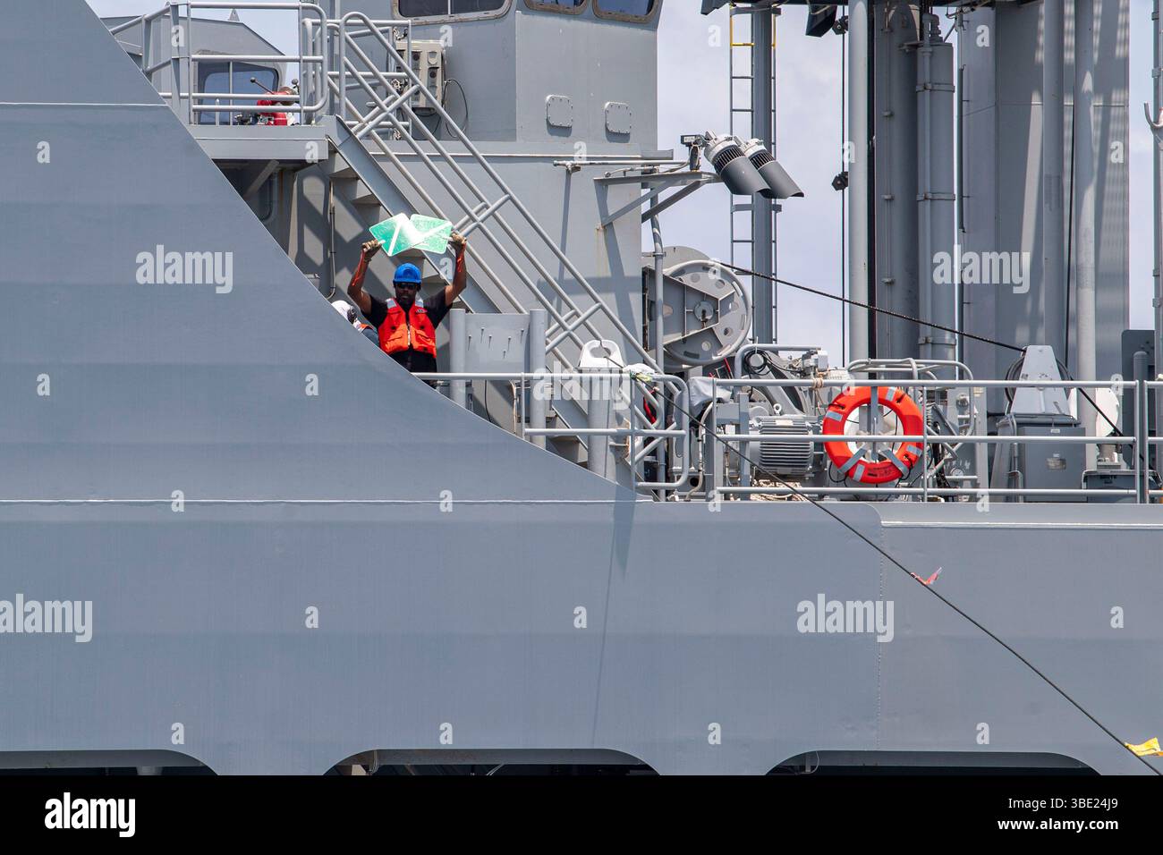 A Sailor aboard the fleet replenishment oiler USNS John Lewis (T-AO 205 ...