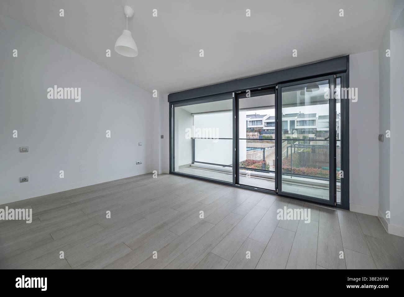 Rooms with large aluminum windows and balconies represent the ...