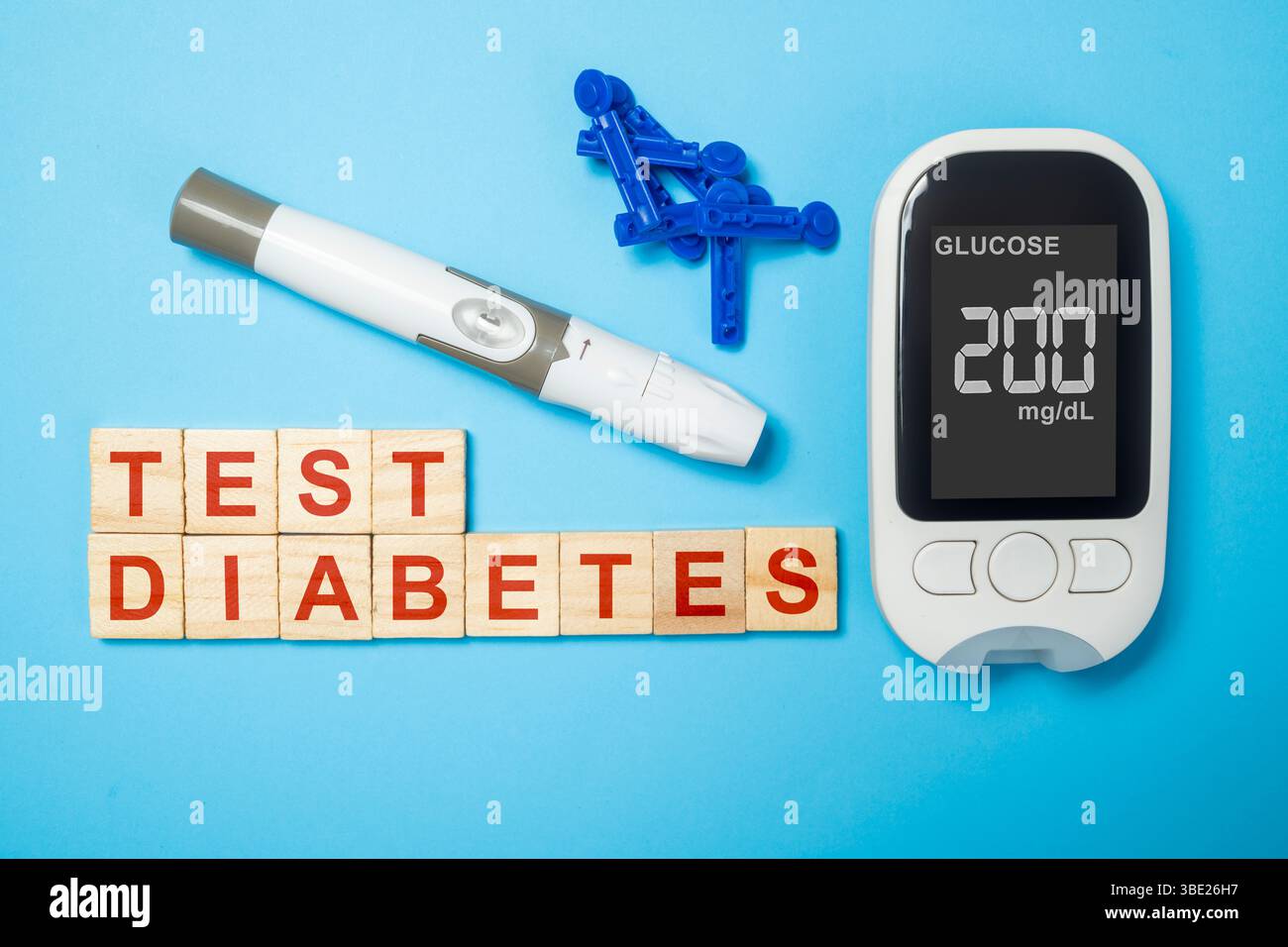 Glucometer with the glucose level on the screen with lancet and text of ...