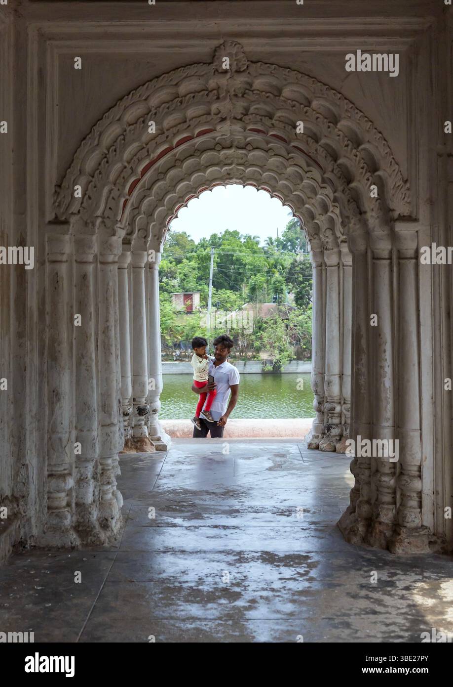Father and his son in Shiva temple, Rajshahi Division, Puthia, Bangladesh Stock Photo - Alamy