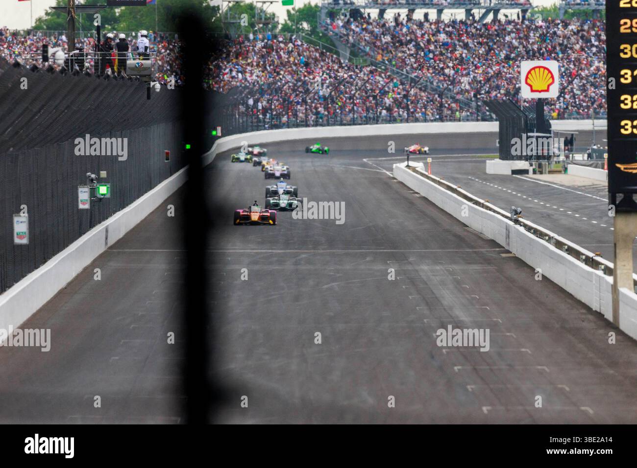 Cars roar past the yard of bricks during the NTT IndyCar Series 109th ...