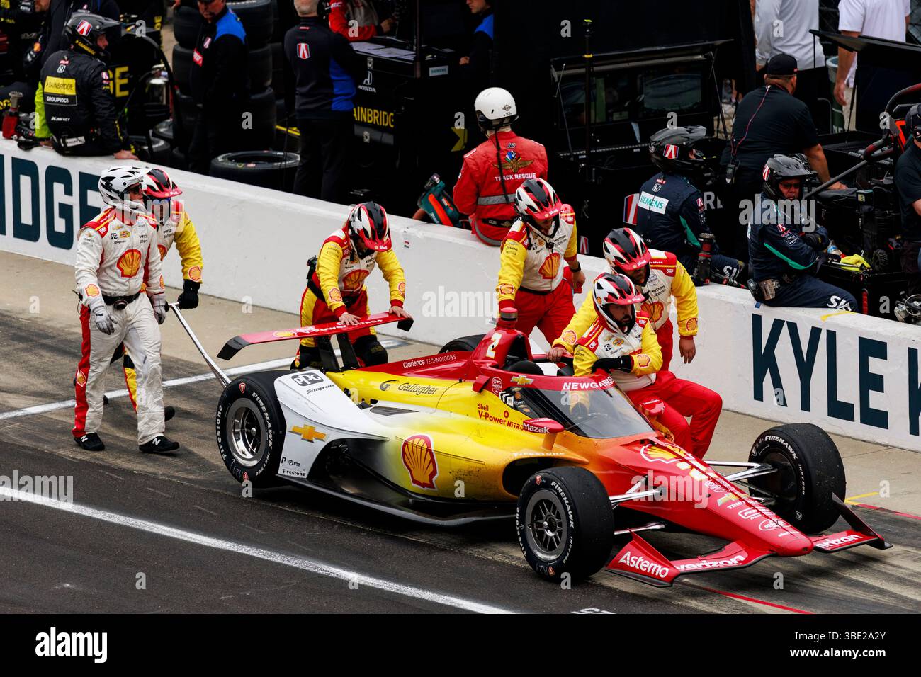 Josef Newgarden’s car is pushed to the garage after the fuel pump ...