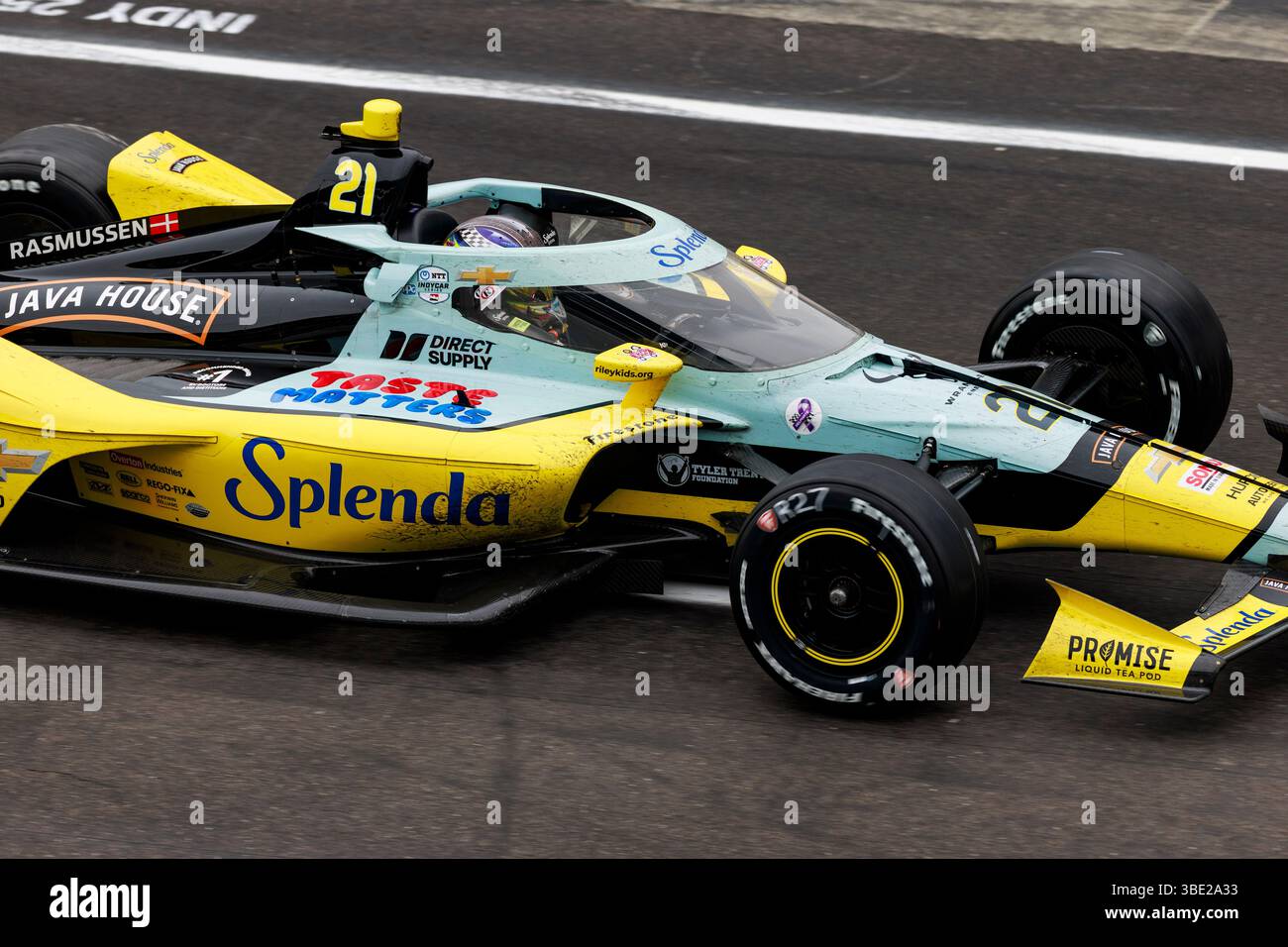 Christian Rasmussen (#21, Ed Carpenter Racing) drives in pit row during ...
