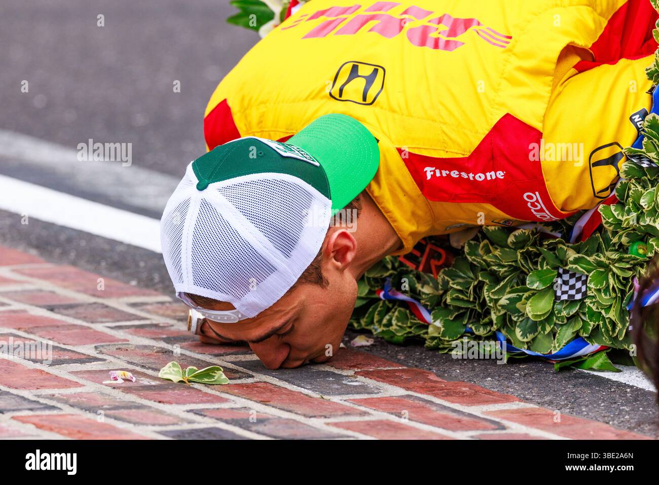 Álex Palou (#10, Chip Ganassi Racing) kisses the ground after winning the NTT IndyCar Series ...
