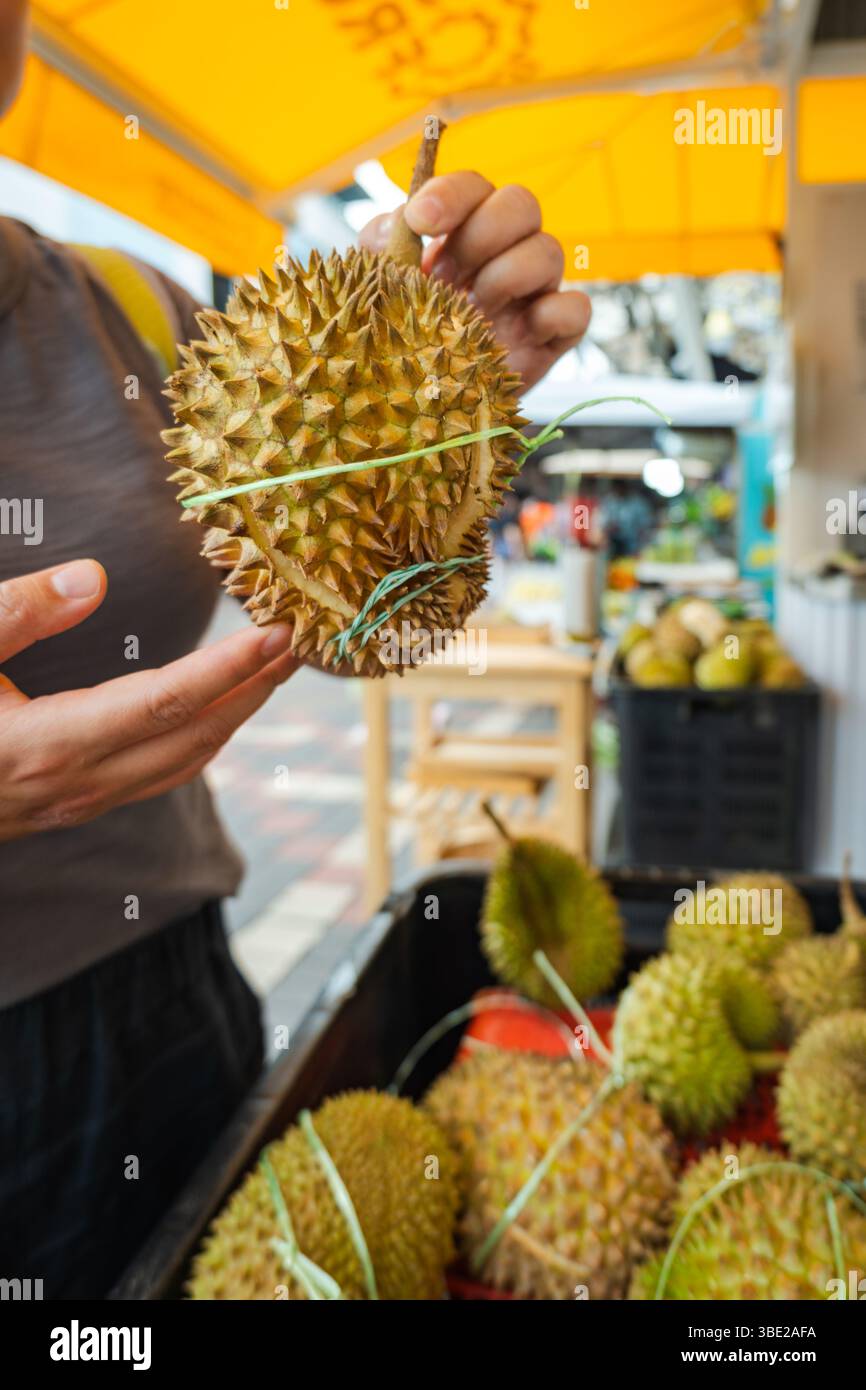 Durian fruit in fruit market in Asia. The durian is the edible fruit of ...