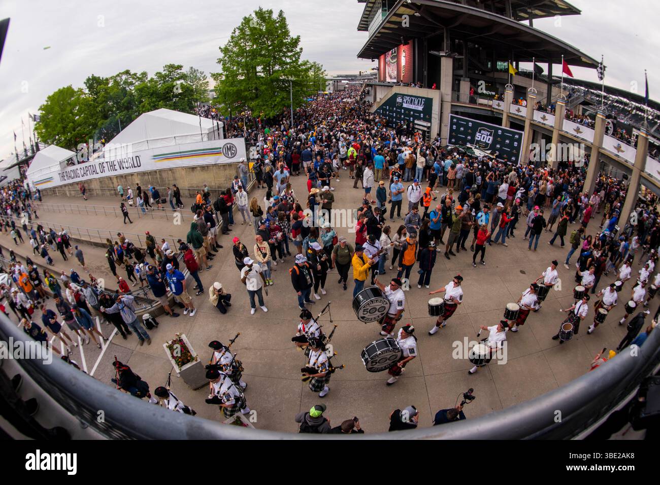 A marching band passes the Pagoda before the NTT IndyCar Series 109th Running of the ...
