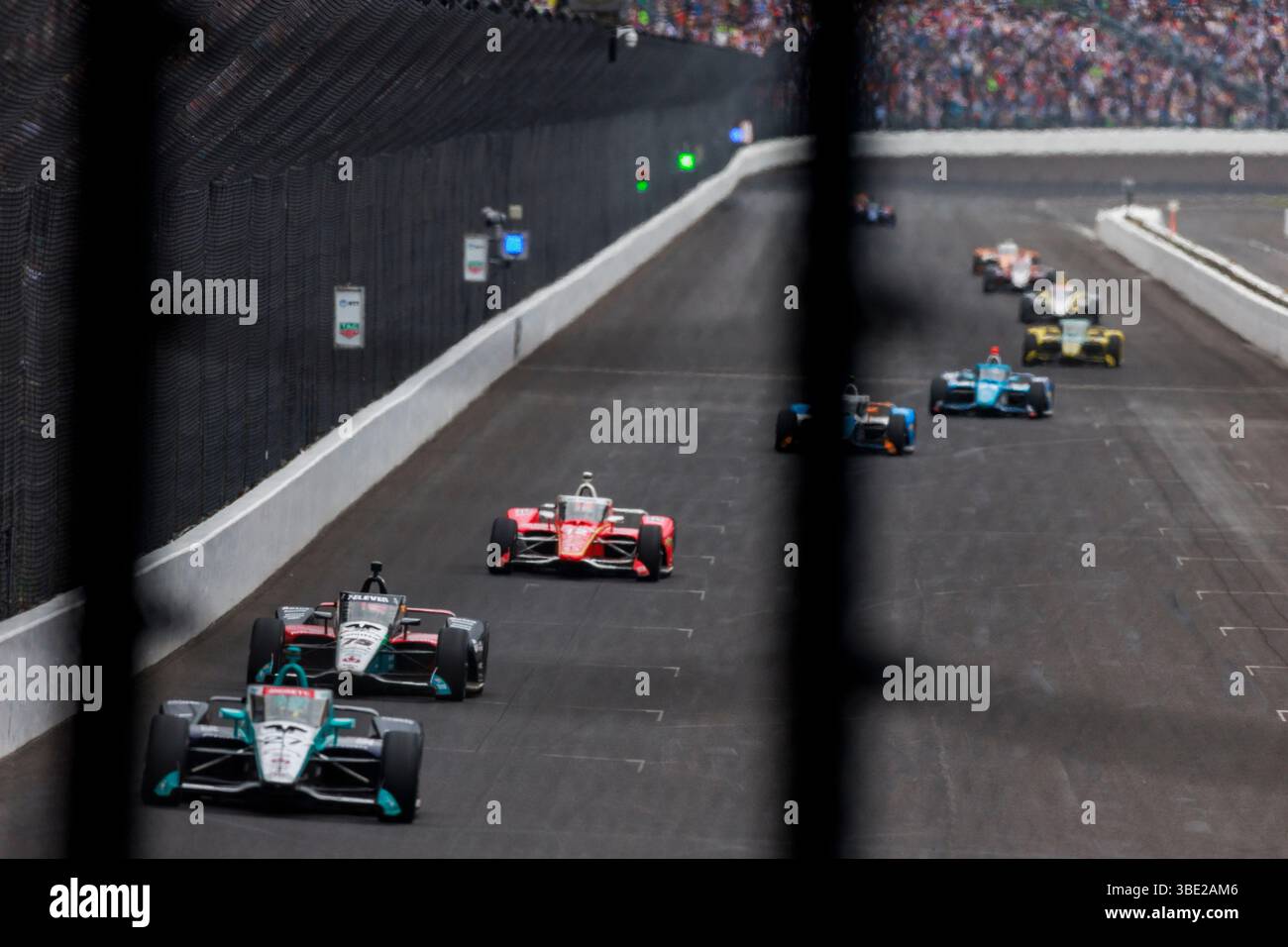 Cars roar past the yard of bricks during the NTT IndyCar Series 109th ...