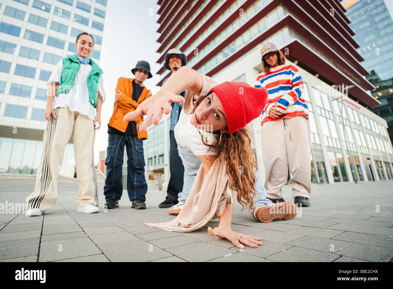 Exciting group of friends engaging in dynamic dance poses, expressing their passion for movement ...