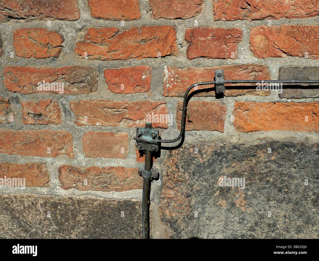 Grounding cable on brick wall of St. Mary’s Church Stralsund. Space for ...