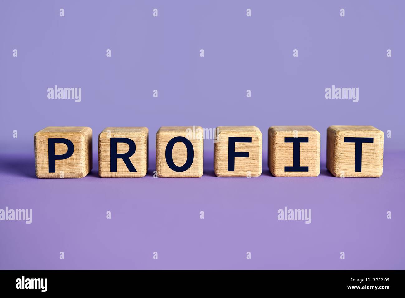 The word PROFIT on wooden blocks over vibrant purple background ...