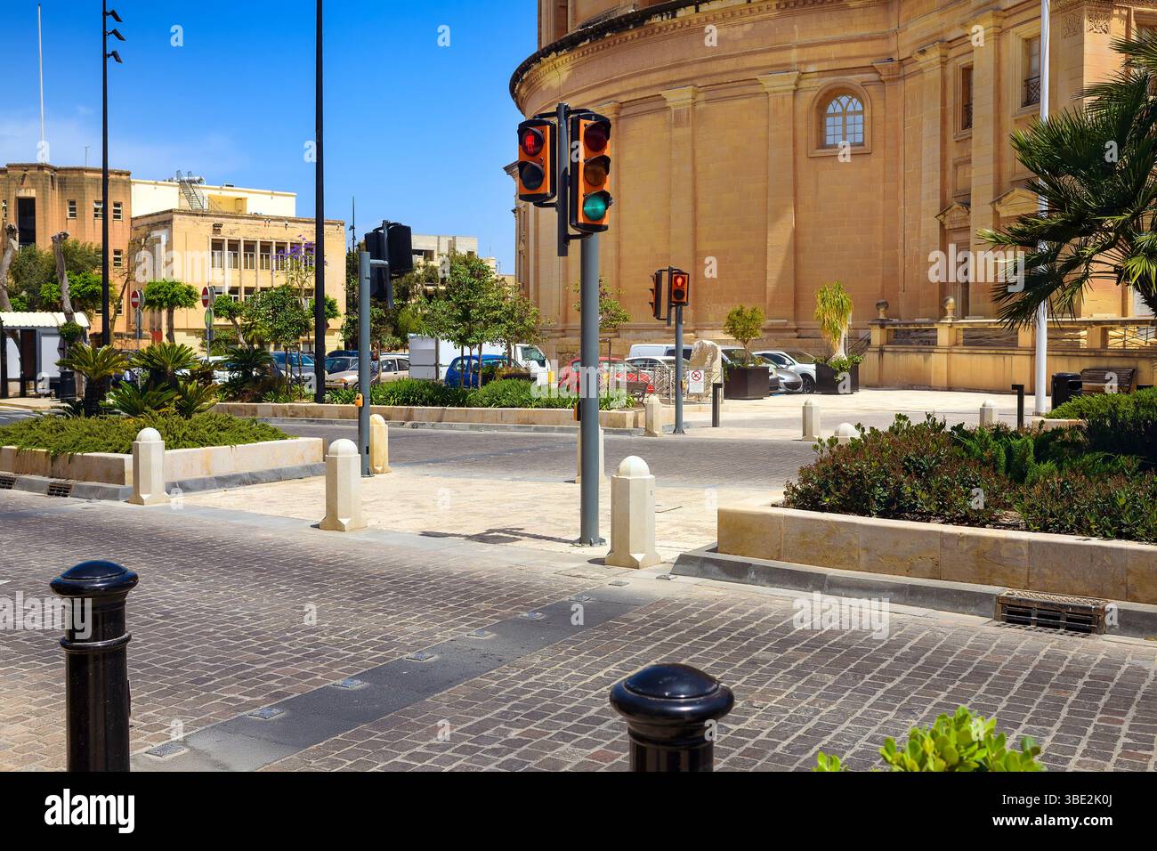 Urban intersection with a signal-controlled crosswalk. Stone buildings ...