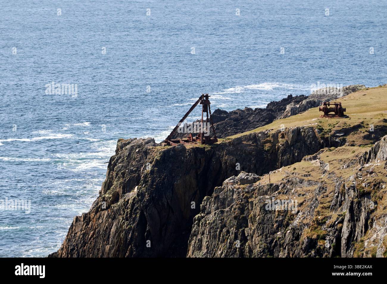 rusting salvage equipment on rocky atlantic shoreline cliffs at the ...