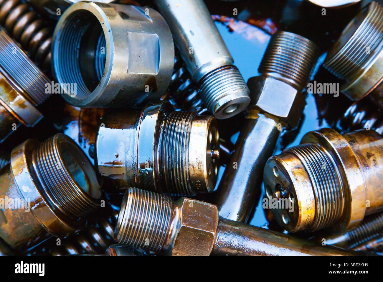 Details of the ship's main engine in oil close-up. Nozzles, bushings ...